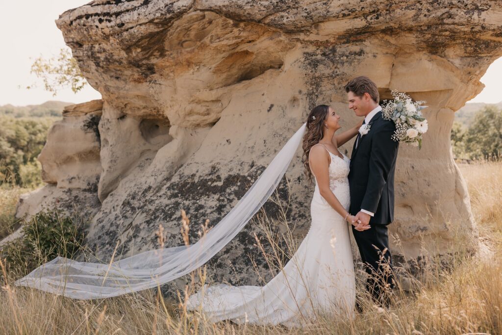 Neutral Estevan Wedding with portraits in Roche Percee